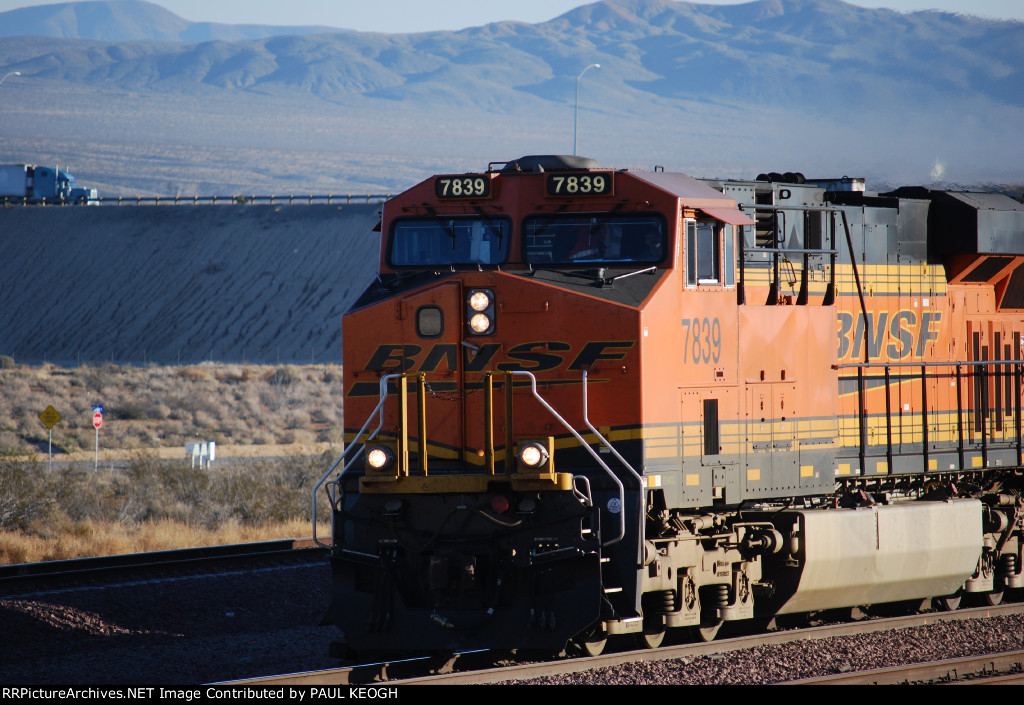 BNSF 7839 heads westbound as the Engineer blows her horn as I took this photo.